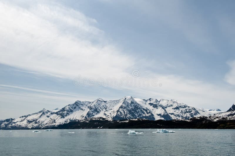 Snowy mountains and ocean stock image. Image of wintertime - 11623319