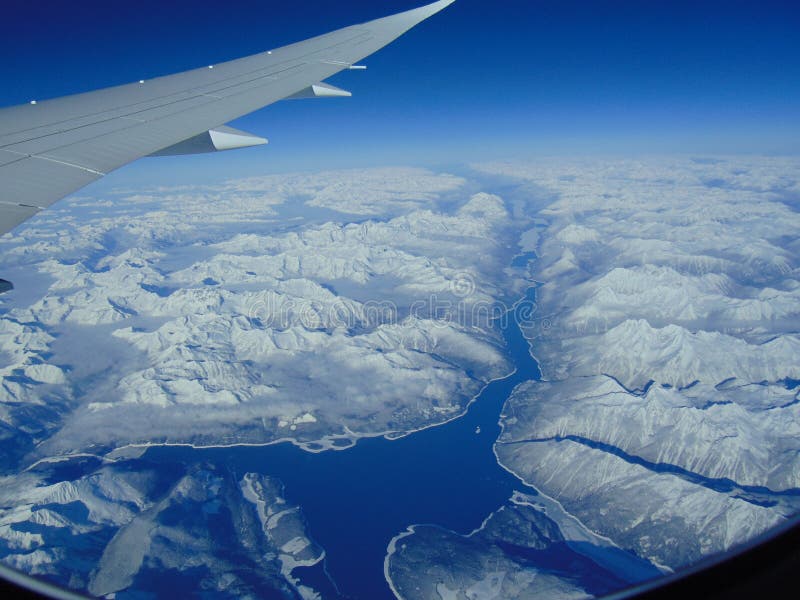 Snowy Mountains from a Plane Stock Photo - Image of blue, snow: 136787090