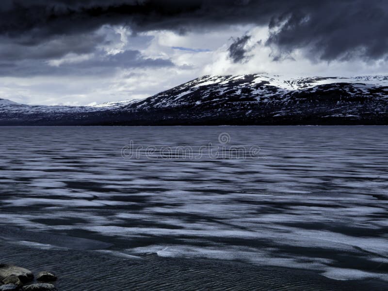 Snowy mountains and sea stock image. Image of scenery - 20003941