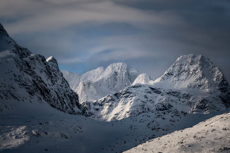 Snowy Mountains Under Dramatic Sky Stock Image - Image of remote ...