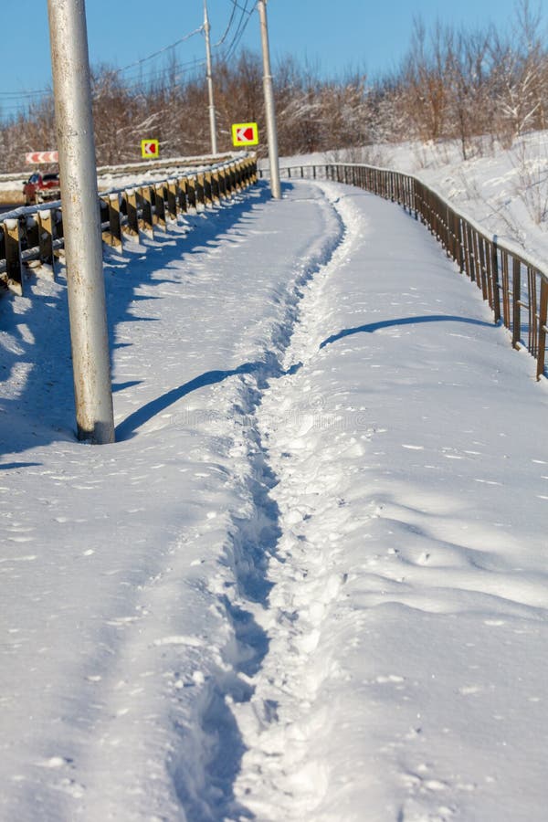 A Snowy Path with a Yellow Sign that Says K Stock Photo - Image of cold ...