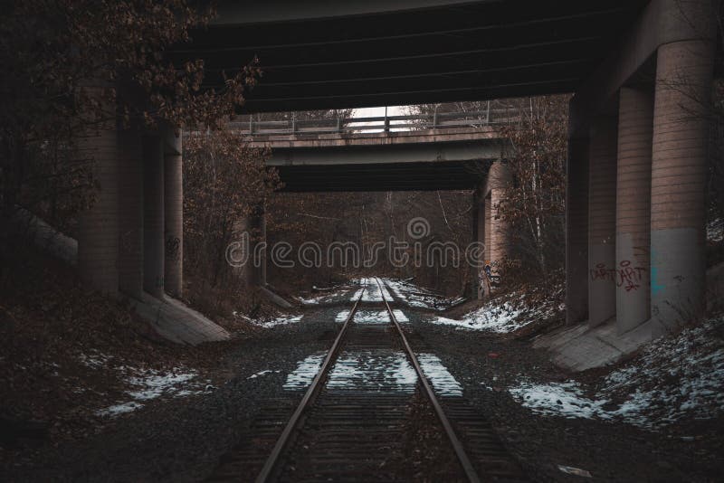 Snowy Railway Trails Under the Bridge in the Weathered Forest Stock ...