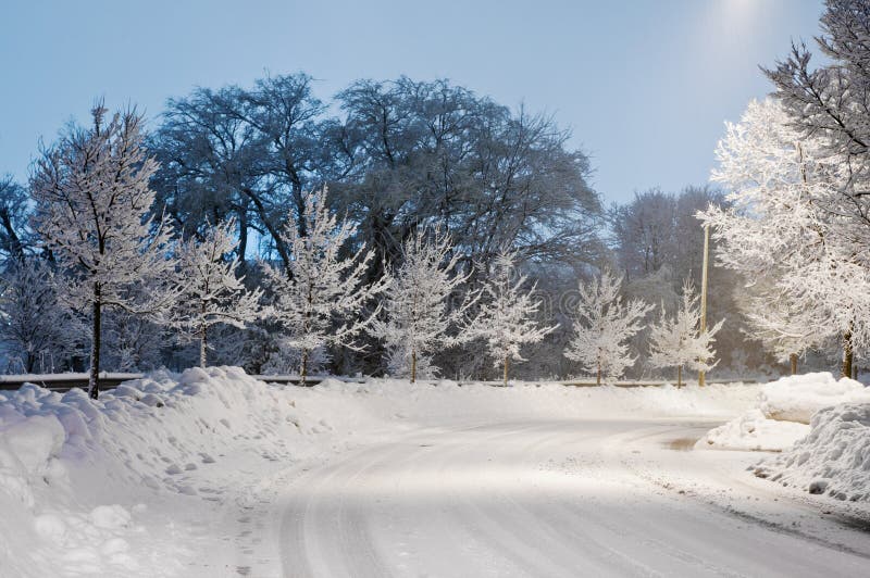 Snowy road at night stock image. Image of cold, evening - 29496939