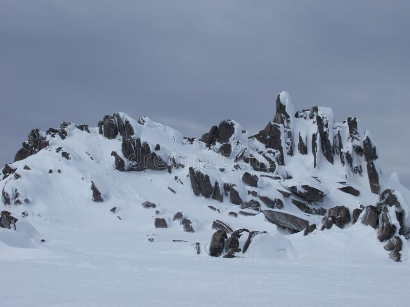 A snowy rock backdrop stock image. Image of arctic, mountain - 254974697