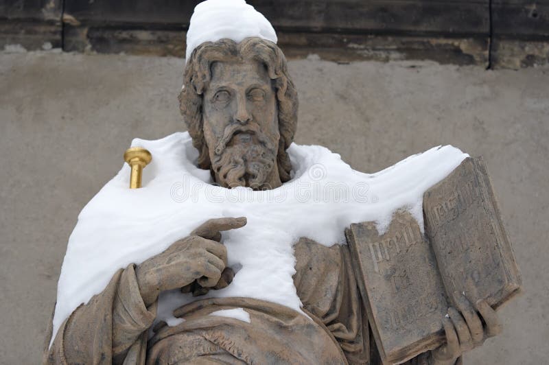 Snowy statue of Saint stock image. Image of expression - 47307115