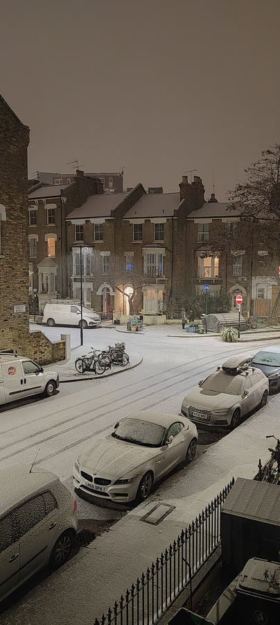 Snowy Street on a Winter Evening Stock Photo - Image of vertical, view ...