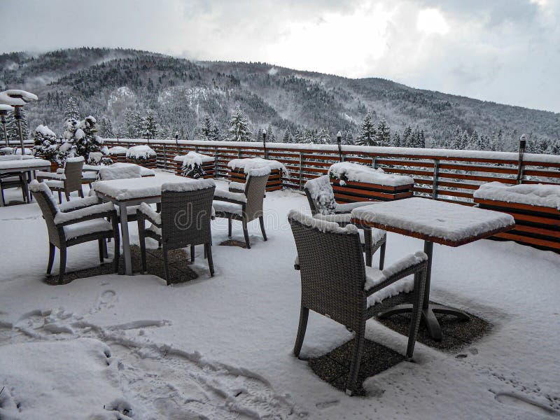 Snowy Summer Terrace with Tables and Chairs Stock Image - Image of cold ...