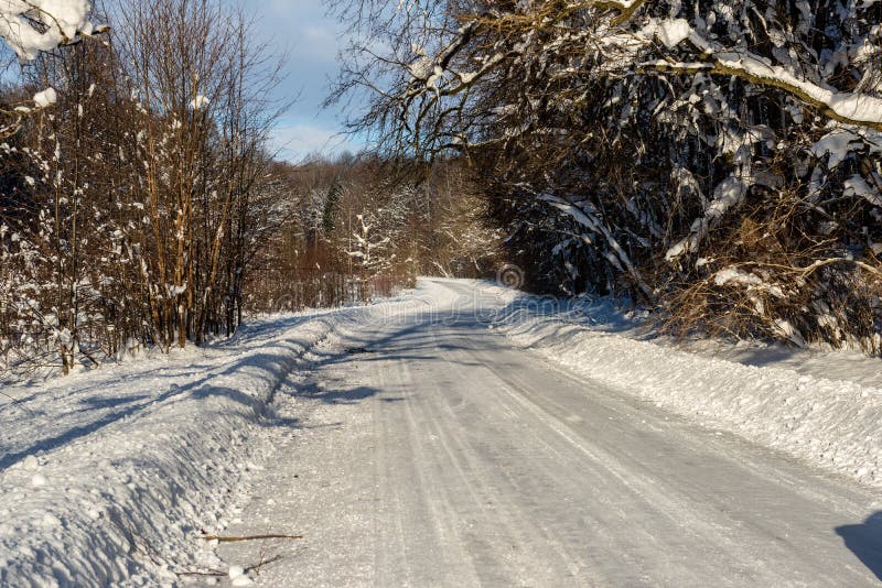 Snowy Winter Road Covered in Ice and Snow Stock Image - Image of ...