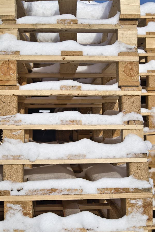 Snowy Wooden Industrial Pallets in Winter Stock Image - Image of stack ...