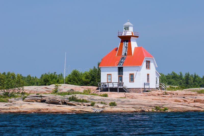 Dog at the Snug Harbour Lighthouse on Georgian Bay Stock Image - Image ...
