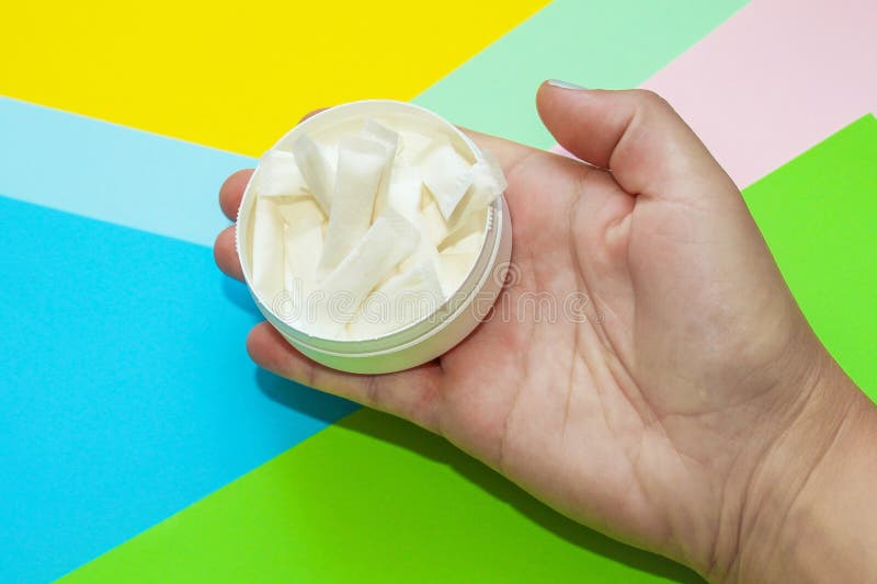 Snus Pads, Nicotine Spiders in Hands on a Paper Background, the Concept ...