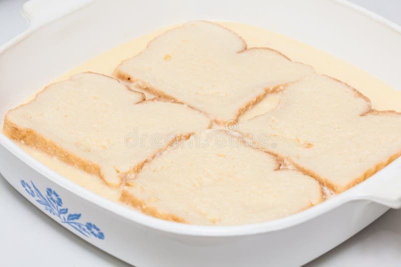 Soaking Bread in the Mix for French Toast Preparation Stock Photo ...