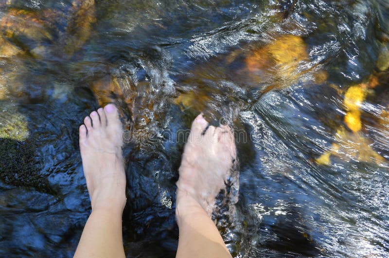 Soaking feet in stream stock photo. Image of healthy - 70137074