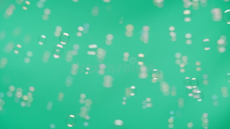 Soap Bubbles Falling Against the Teal Background. Stock Footage - Video ...