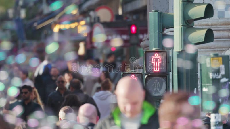 Red Pedestrian Light and Blurred Crowd in a Busy Urban Street Stock ...