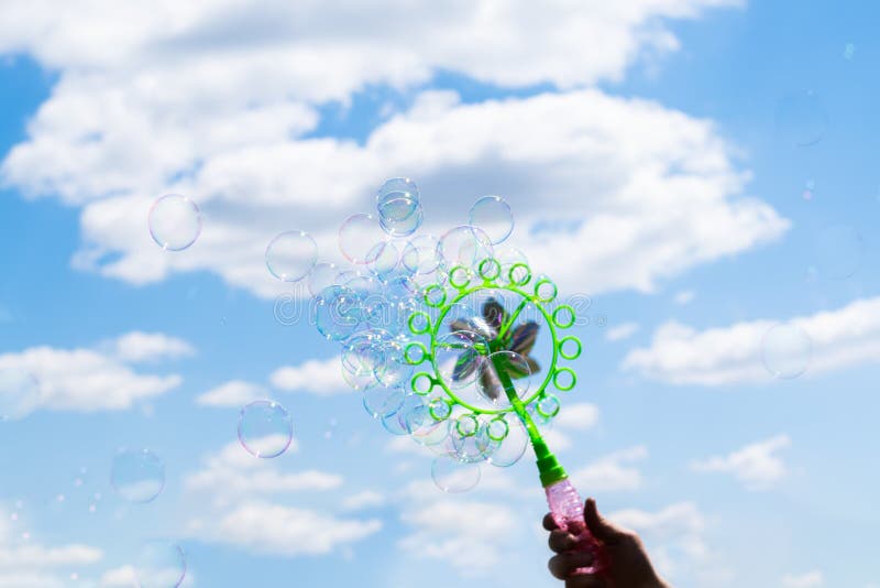 Soap Bubbles Toy with Propeller. Soap Bubble in Front of a Blue Sky in ...
