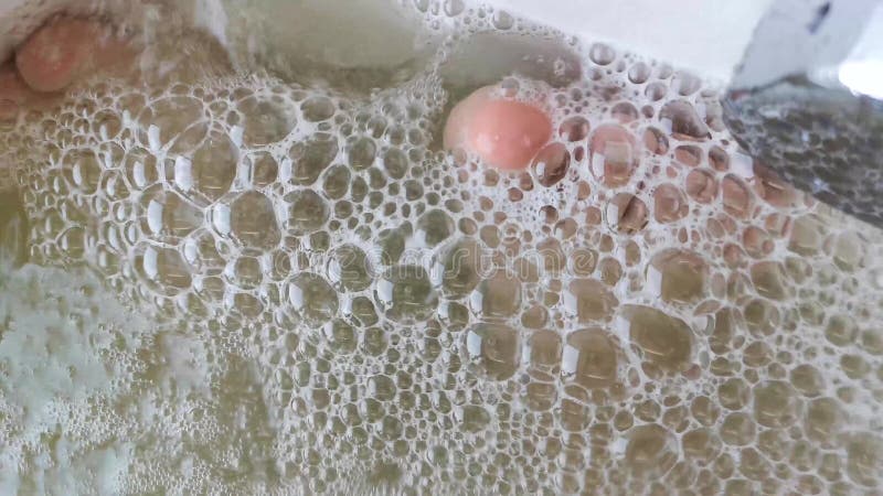 Closeup of Bubbles in the Jacuzzi. through Soap Bubbles Visible Legs ...