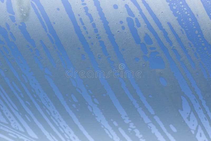 Soap Detergent Foam on a Clear Glass. Blue Background Stock Image ...