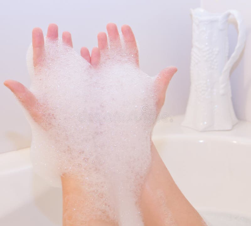 Soap foam on hands in bath stock photo. Image of water - 29871324