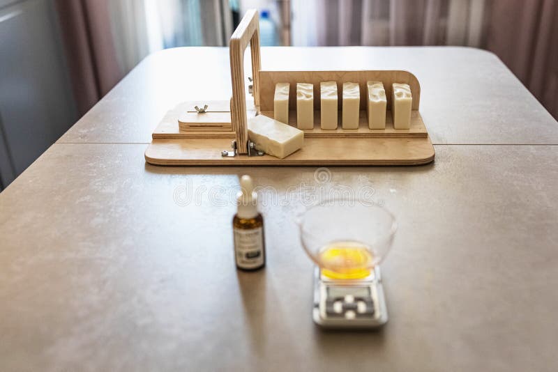 A Soap-maker Weighs Aromatic Oils for Making Cosmetics on a Kitchen ...