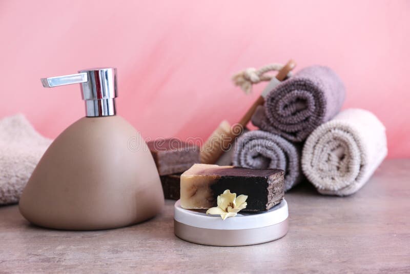 Soap and Towels on Table in Bathroom Stock Photo - Image of table ...
