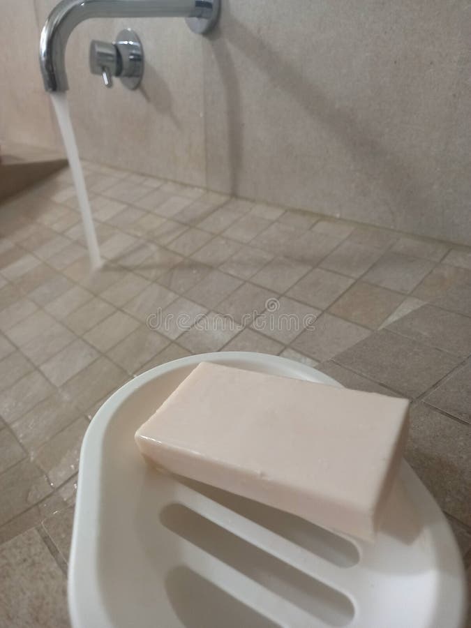 Soap and water tap stock image. Image of bathroom, flowing - 243143601