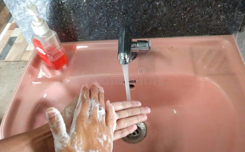 Soapy Hand, Hand Washing with Liquid Hand Wash in Basin Stock Photo ...