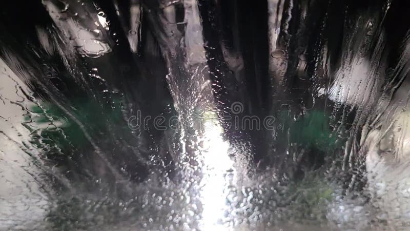 Soapy Water and Streaks of Lights Over Car Widshield Stock Footage ...