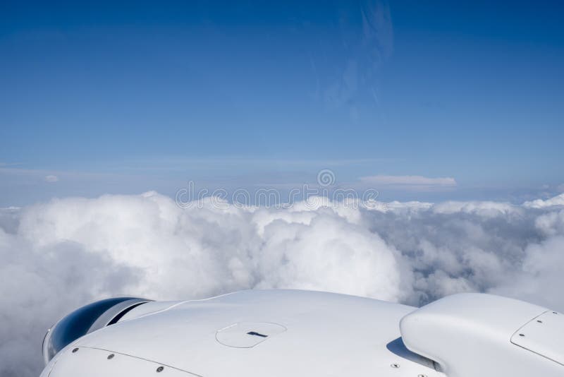 Soaring High Above Clouds & Aircraft Engine Stock Photo - Image of ...