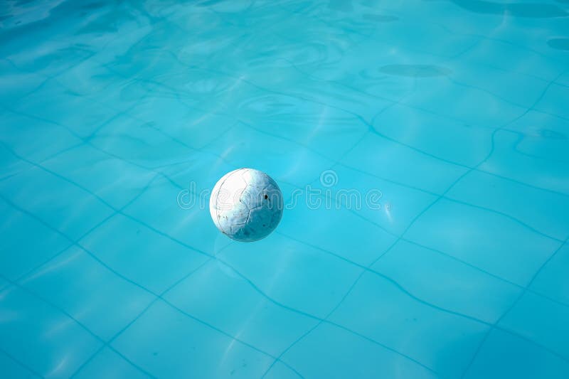 A Soccer Ball Floating Above a Clear Swimming Pool Stock Photo - Image ...