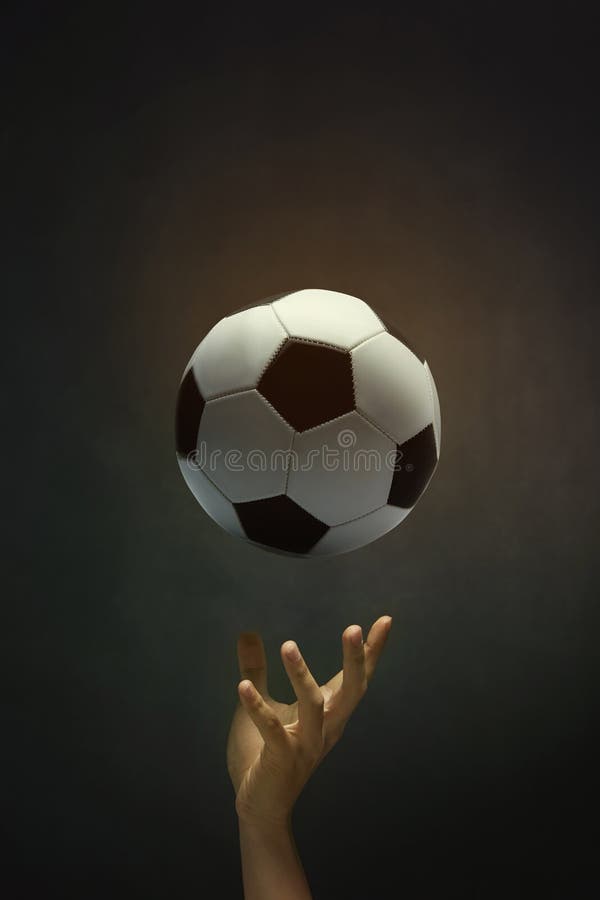 Soccer ball with hand stock photo. Image of graphic - 184948846