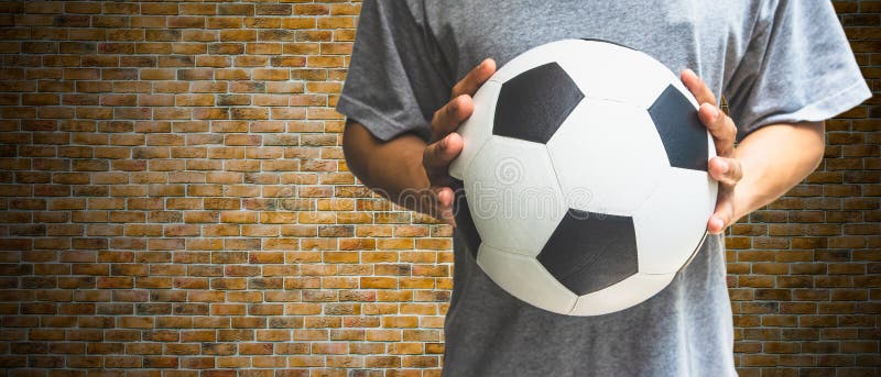 A soccer ball in hands stock photo. Image of champion - 117705814