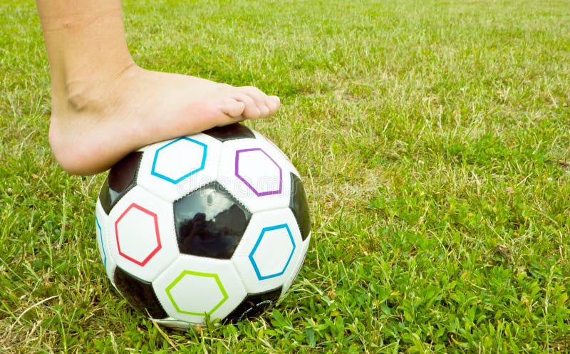 Soccer Ball with Kids Foot on it Stock Image - Image of recreational ...