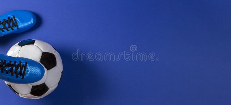 Soccer Ball Under Soccer Players Feet on Blue Background Stock Photo ...