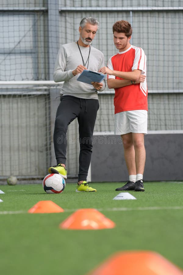 Soccer Coach and Football Player Checking Plan Stock Image - Image of ...