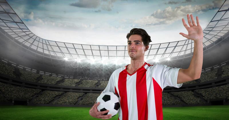 Soccer Player with Arm Raised Holding Ball in Stadium Stock Image ...