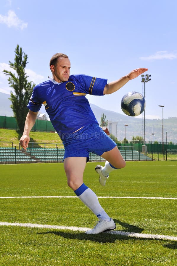 Soccer Player Shooting Ball Stock Photo - Image of kicking, sporting ...