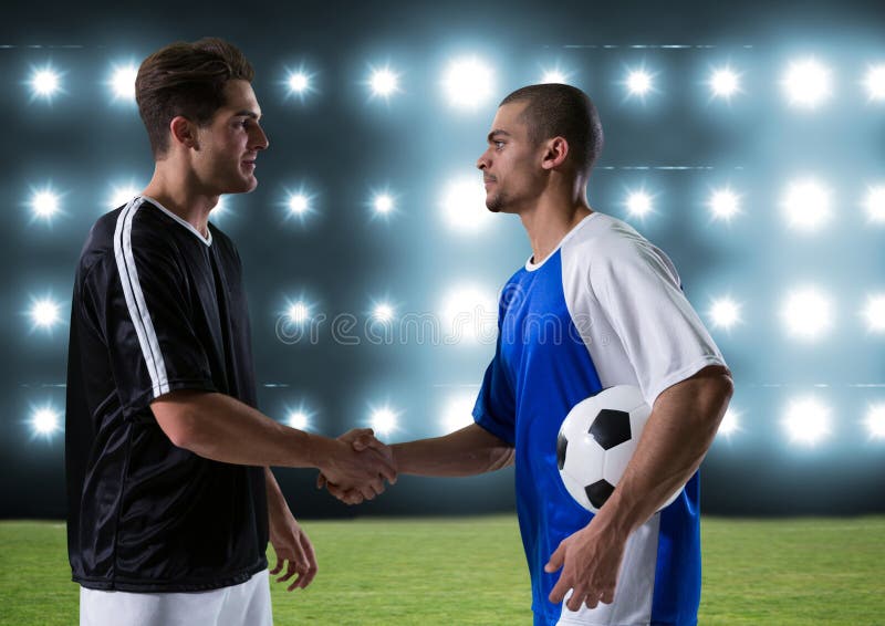 Soccer Players Giving the Hand in the Field Stock Photo - Image of ...