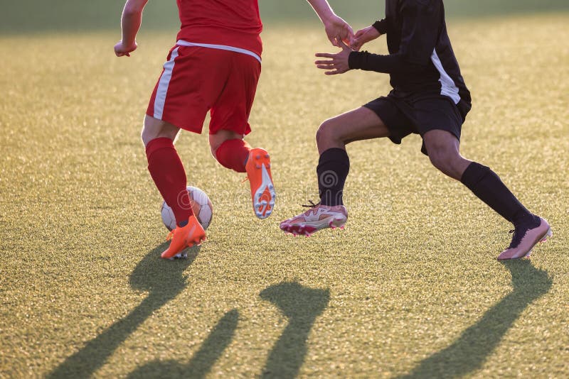 Soccer Players Playing with the Ball on a Soccer Field Stock Photo ...