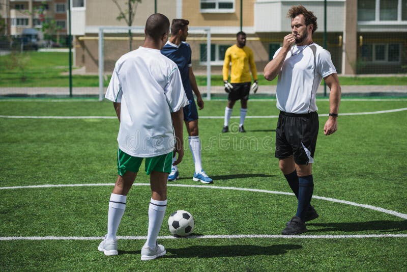Soccer Players during Soccer Match on Pitch, Focus on Foreground Stock ...