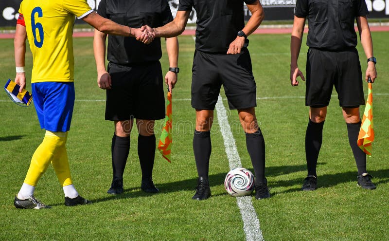 Soccer Referees and a Player Handshake Stock Photo - Image of football ...