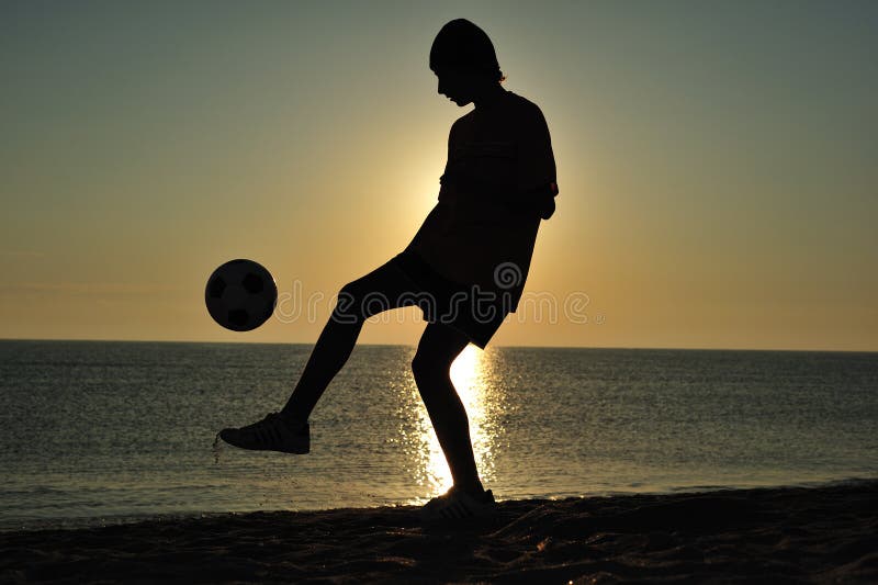Soccer at sunset stock photo. Image of sunrise, play, sportsman - 6762642