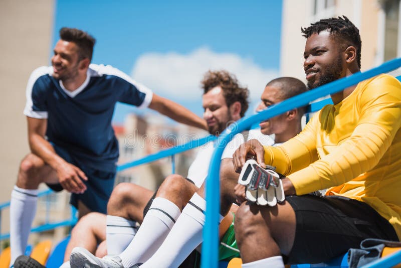 Soccer Team Sitting on Stadium during Soccer Match Stock Photo - Image ...