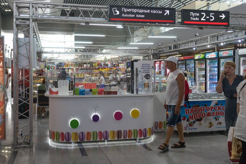 The Interior of the Train Station with Shops and People. Editorial ...