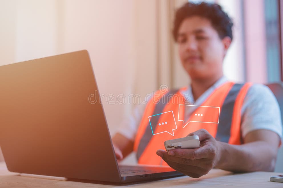 Social Media an Engineer Working on Site Using Smartphone Typing Live ...