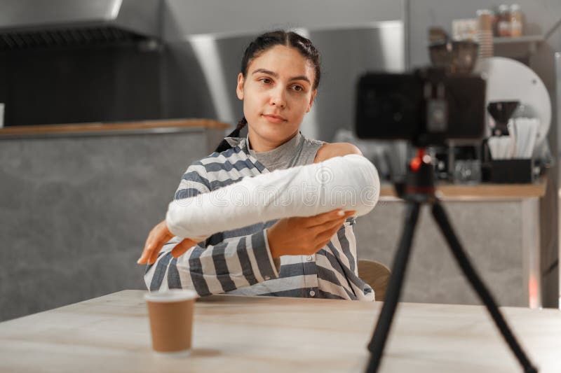 Social Media Influencer with Broken Hand Creating Content Inside Small ...