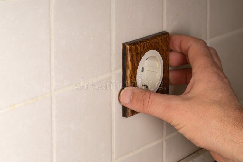 Socket Installation. a Master Electrician Installs an Electrical ...