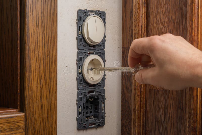 Socket Installation. a Master Electrician Installs an Electrical ...