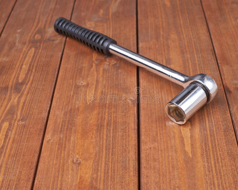 Socket Metal Wrench with Black Handle on Wooden Surface Stock Image ...