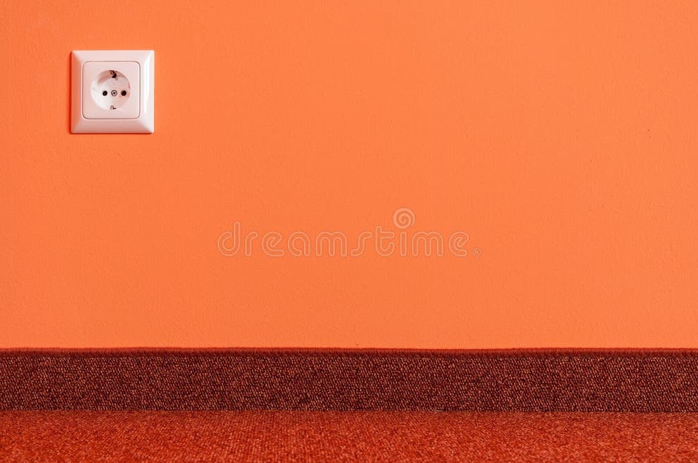 Socket on an Orange Wall in a New Building Stock Photo - Image of ...